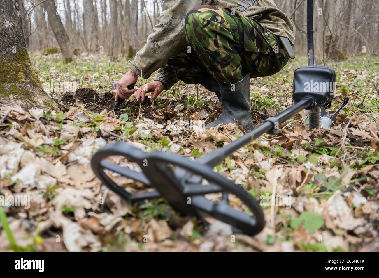 Man metal detector digging in hi-res stock photography and images - Alamy