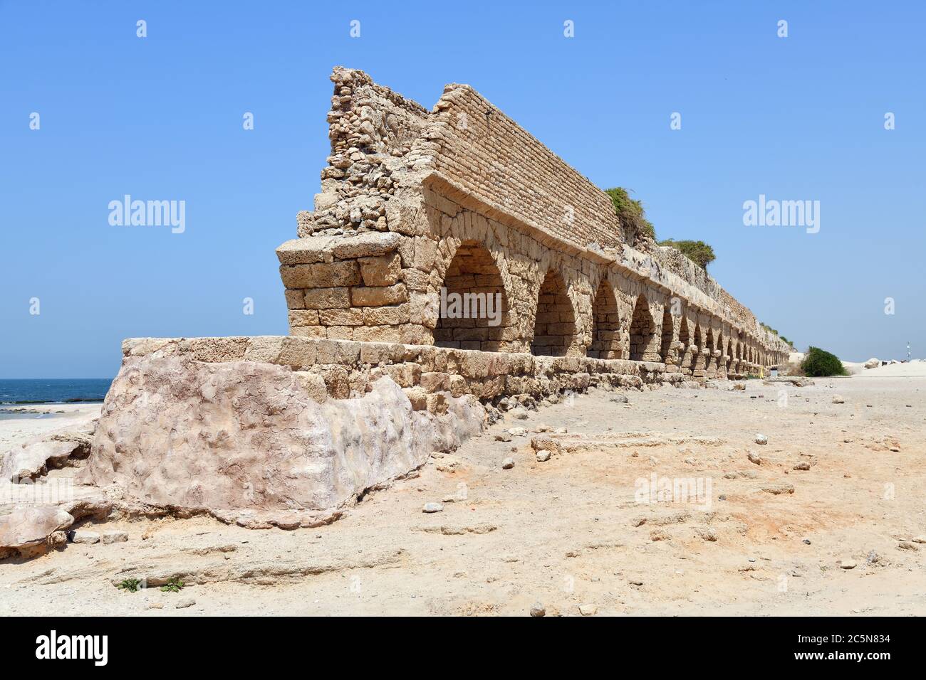 The ruins of the ancient Roman Aqueduct in city of Caesarea Maritima ...