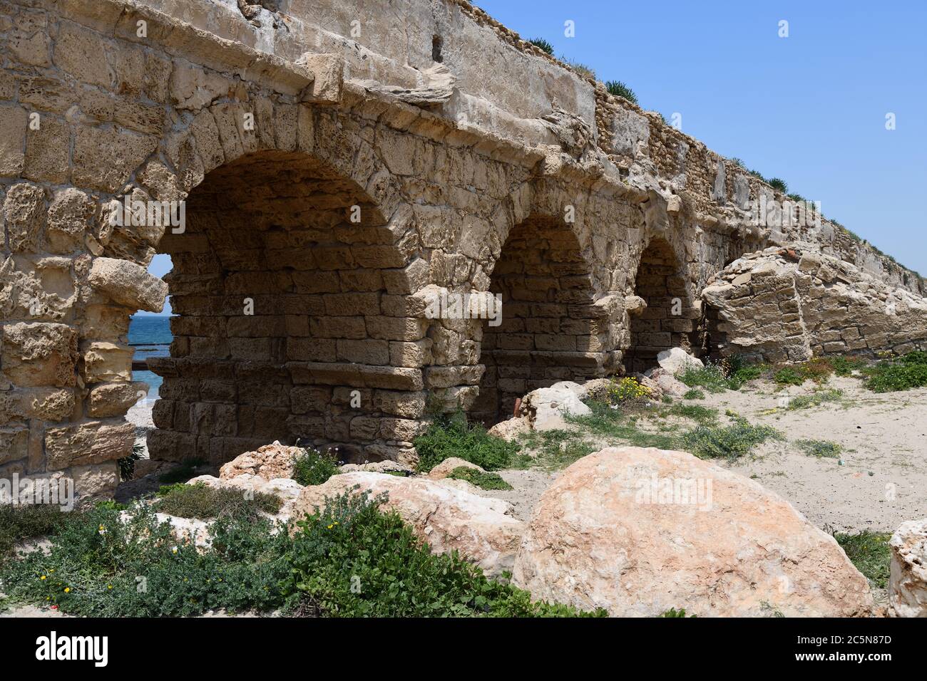 The ruins of the ancient Roman Aqueduct in city of Caesarea Maritima ...