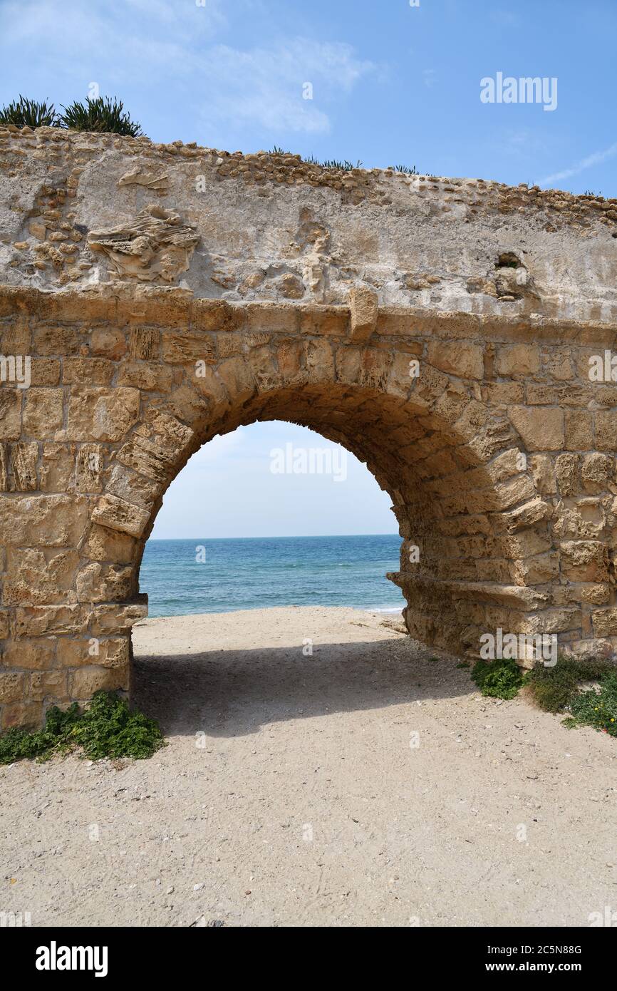 The ruins of the ancient Roman Aqueduct in city of Caesarea Maritima ...