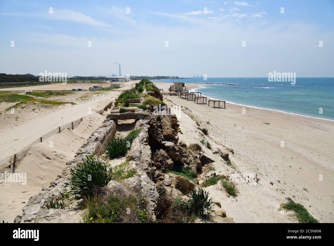 The famous beach nearby ruins of the ancient Roman Aqueduct in city of ...