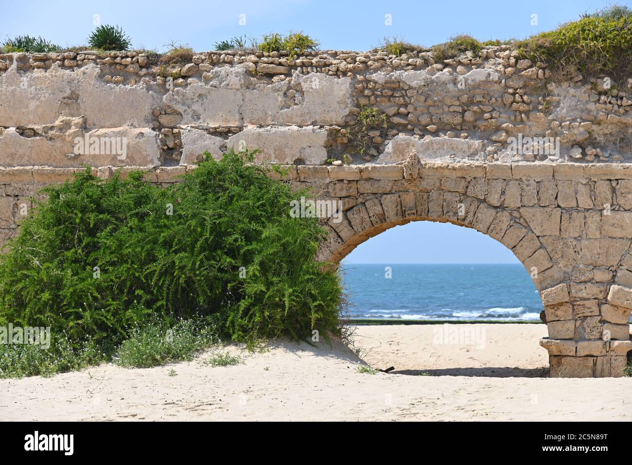 The ruins of the ancient Roman Aqueduct in city of Caesarea Maritima ...