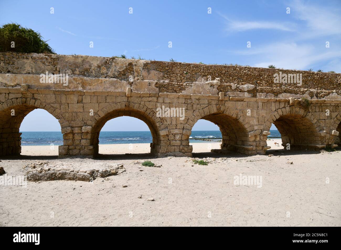 The ruins of the ancient Roman Aqueduct in city of Caesarea Maritima ...