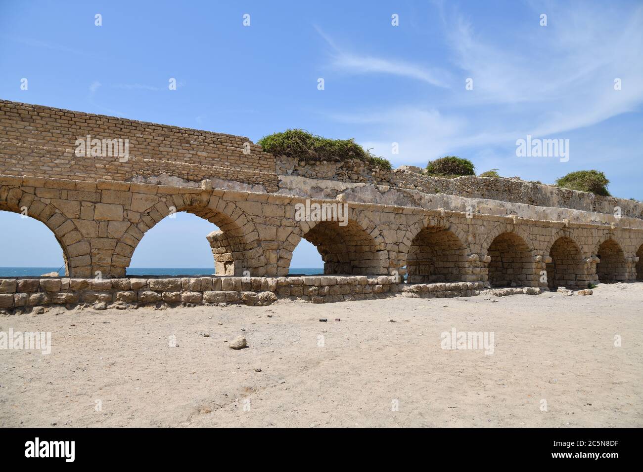 The ruins of the ancient Roman Aqueduct in city of Caesarea Maritima ...