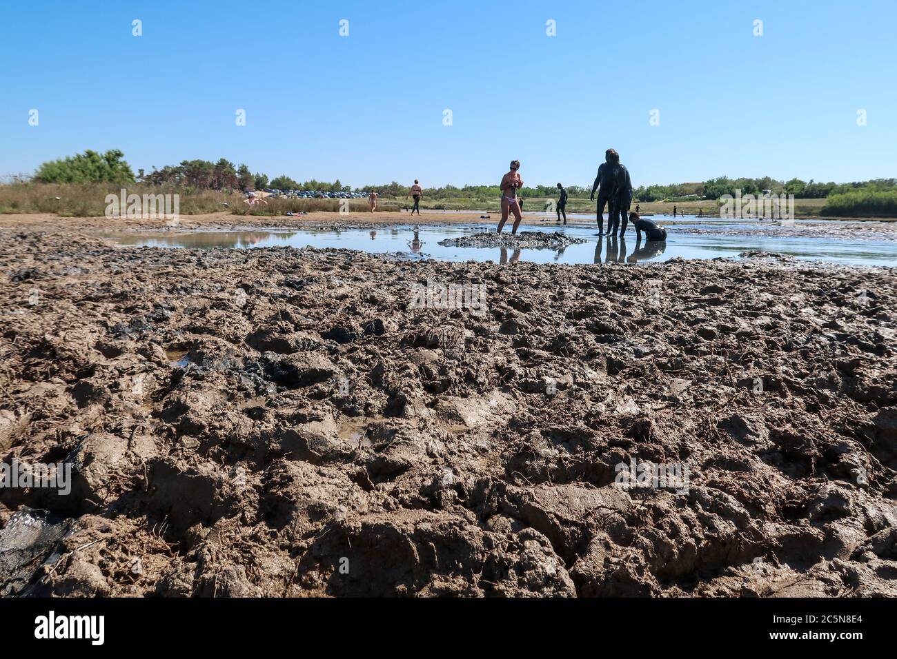 People enjoy Nin’s therapeutic healing mud lagoon in Croatia. Queen's ...