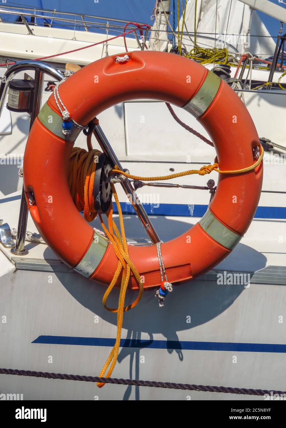 Red lifebuoy with rope on the yacht Stock Photo - Alamy