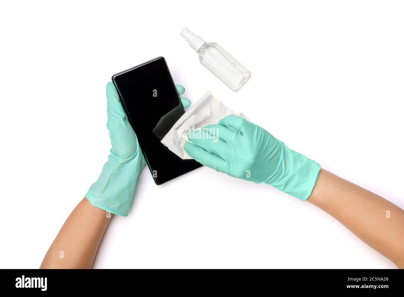 Female's hands wiping mobile phone with alcohol sanitizing agent, top ...