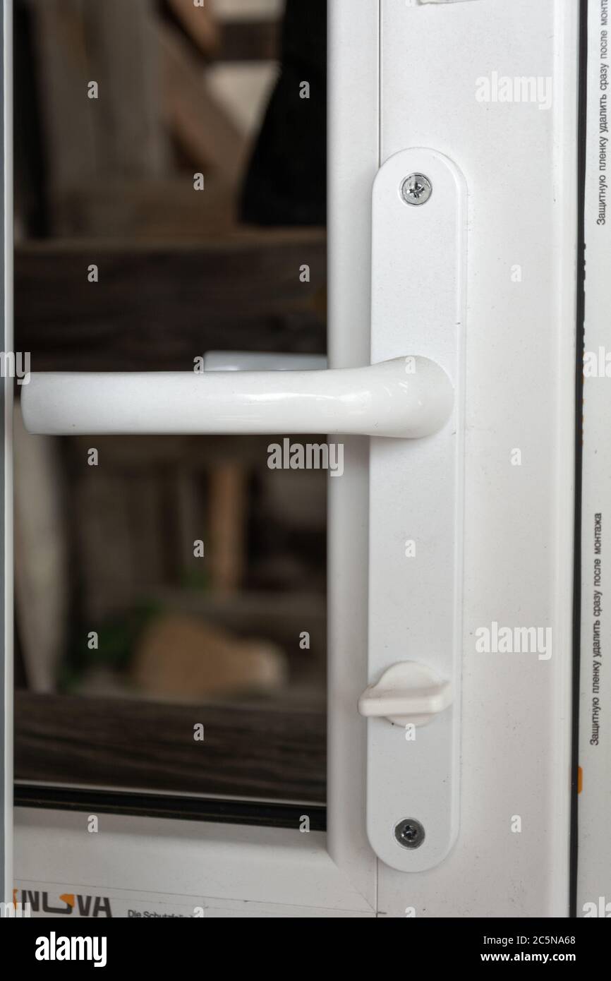 PVC door handle. Production of pvc plastic doors and windows Stock ...