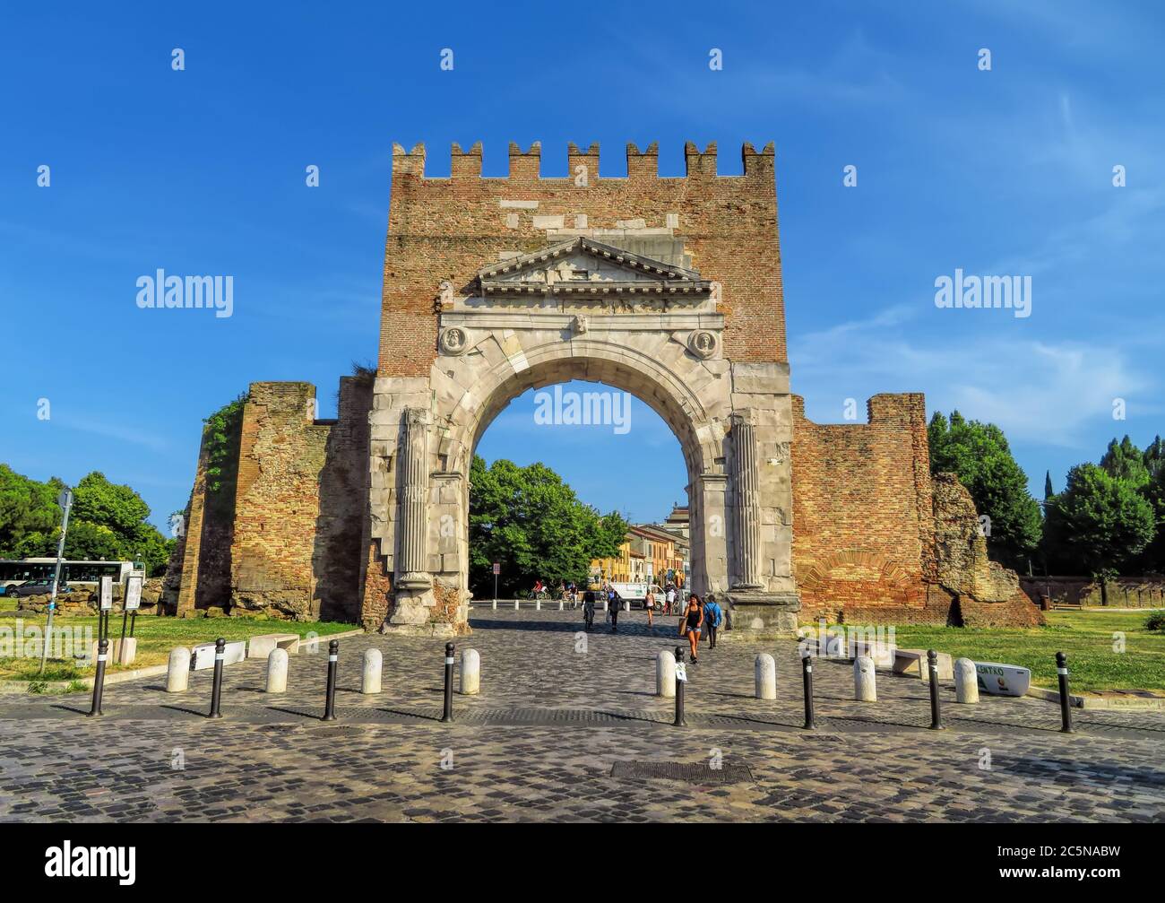 Rimini, Italy - June 21, 2017: Unidentified people walk under Augustus ...