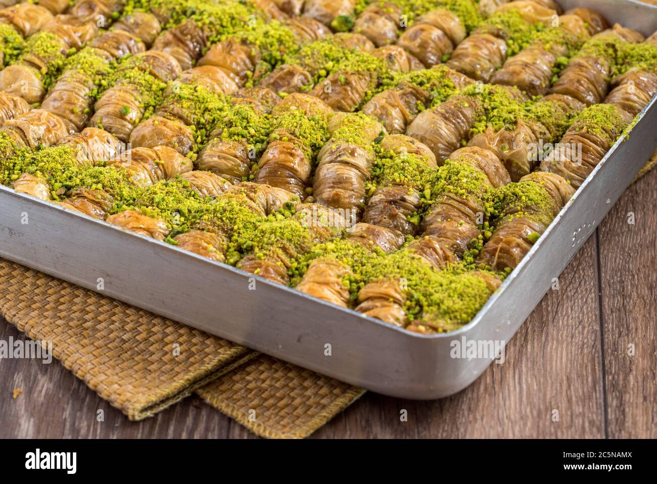 Traditional Turkish dessert in tray on wooden table Stock Photo - Alamy