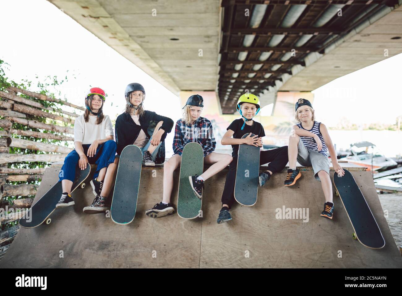 Happy friends in city park for extreme sports. Little ones having fun ...