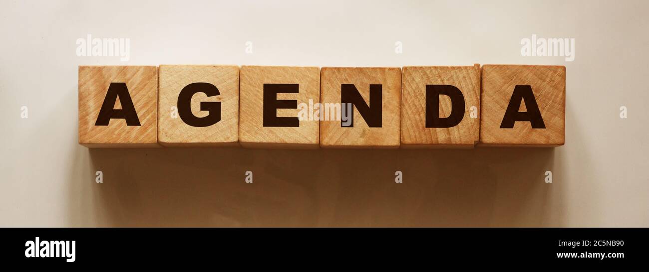 Agenda - words from wooden blocks with letters, a list of matters ...