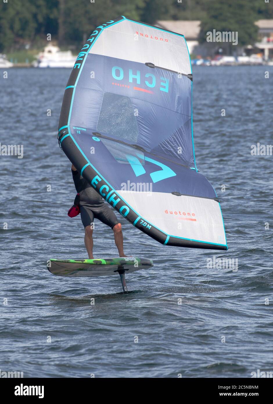 Berlin, Germany. 04th July, 2020. A wing surfer rides the waves of the ...