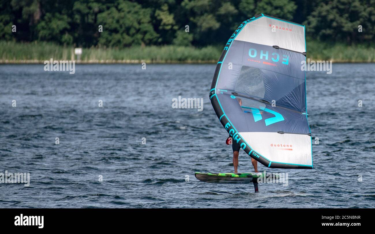 Berlin, Germany. 04th July, 2020. A wing surfer rides the waves of the ...