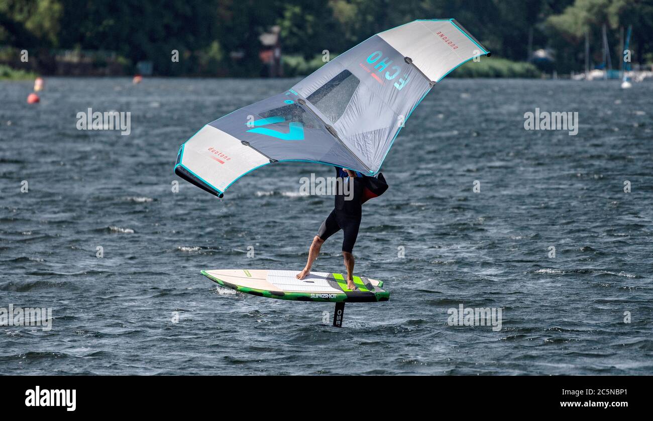 Berlin, Germany. 04th July, 2020. A wing surfer rides the waves of the ...