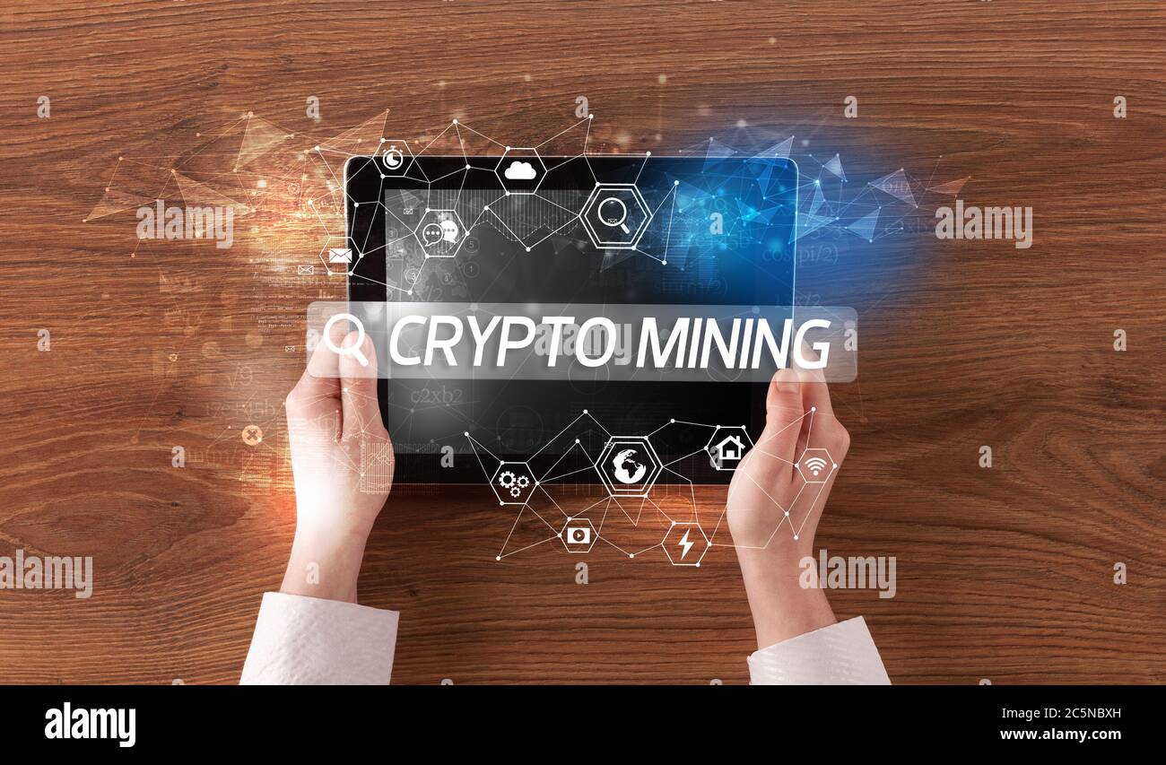 Close-up of a tablet searching CRYPTO MINING inscription, hi-tech computing concept Stock Photo ...