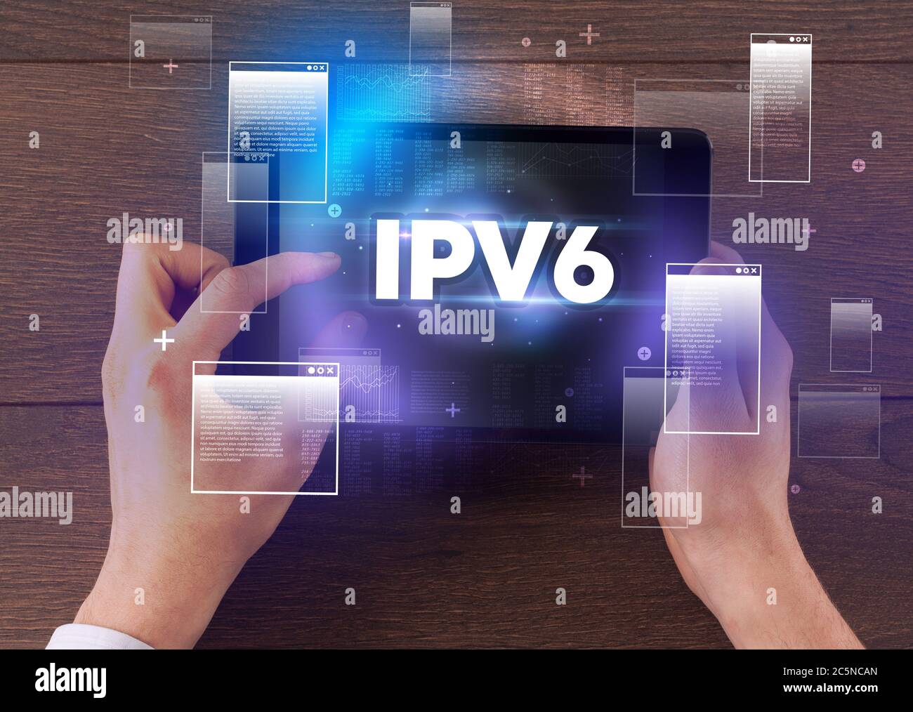 Close-up of a hand holding tablet with IPV6 abbreviation, modern ...