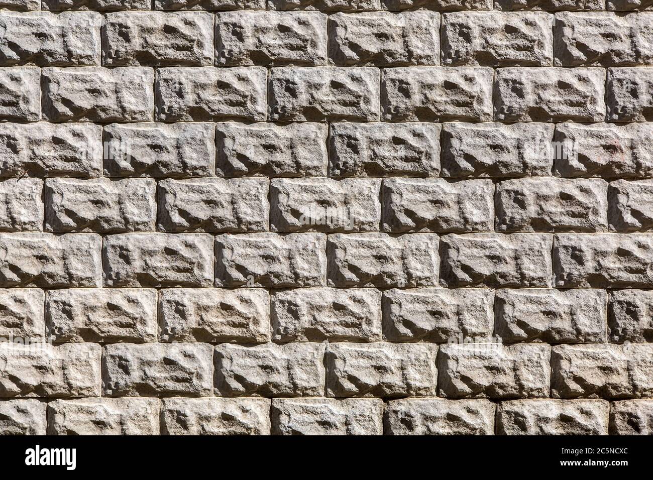 texture of a stone wall with rustication, masonry made of natural stone ...