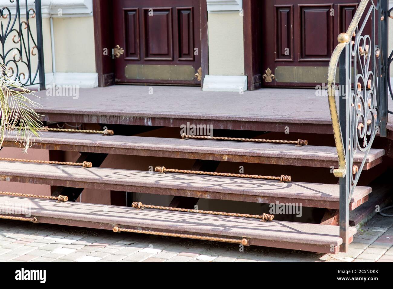 Staircase with steps and iron railings with a threshold in front of ...