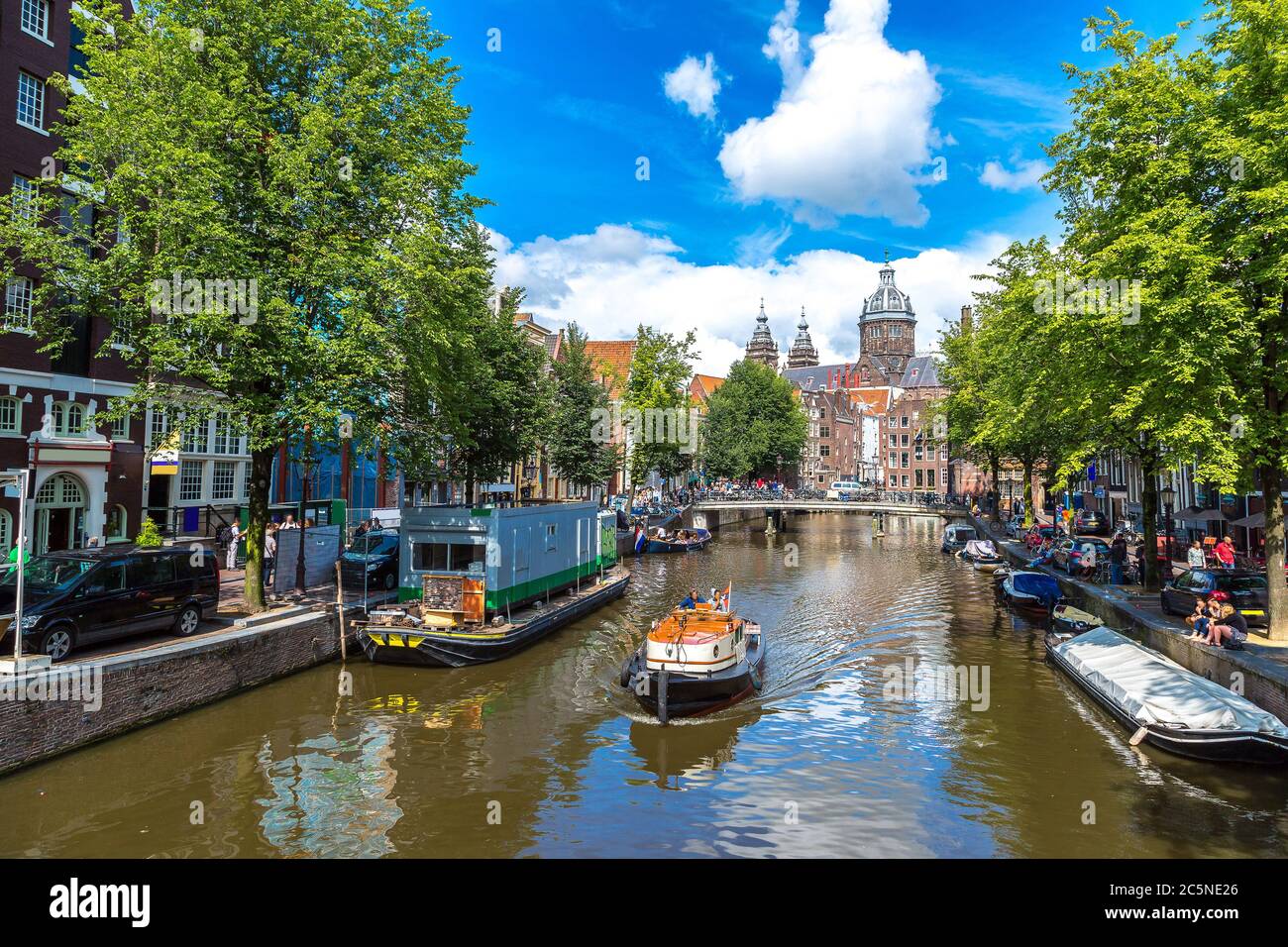 Canal and St. Nicolas Church in Amsterdam. Amsterdam is the capital and most populous city of ...