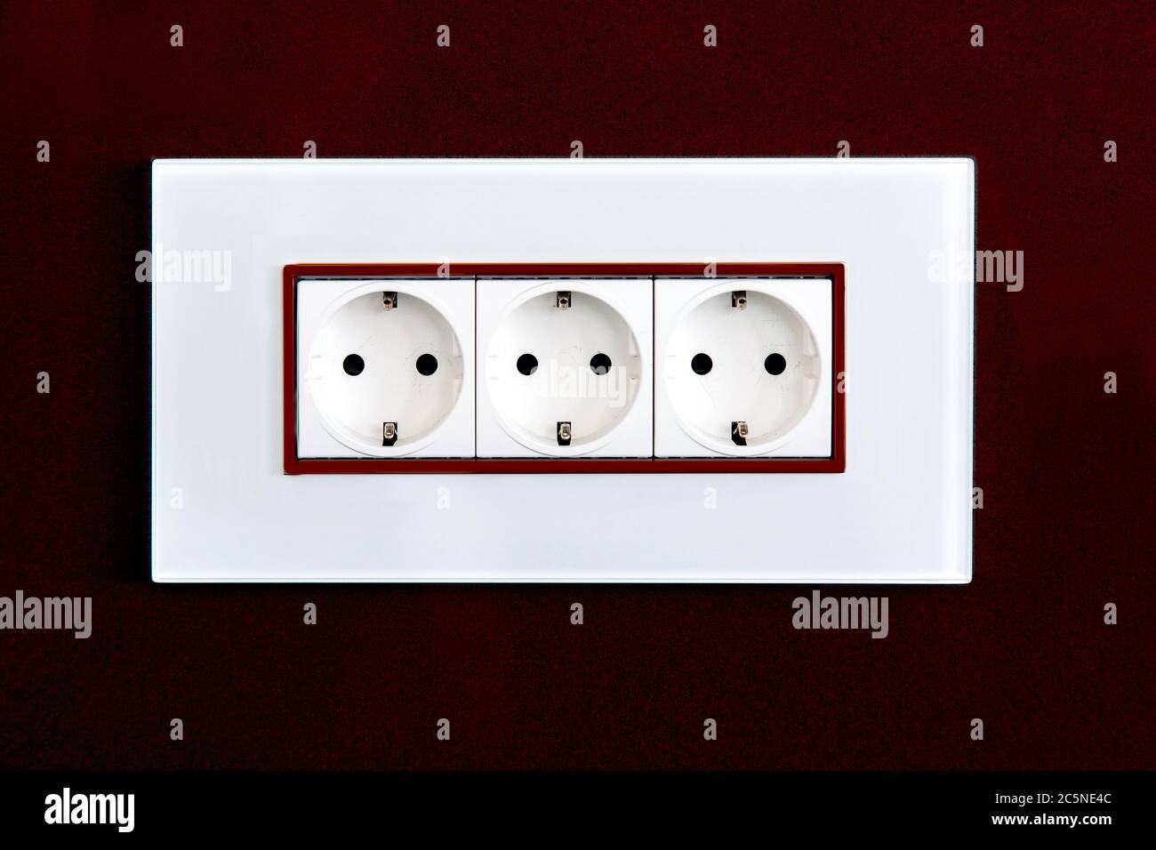 socket with plugs for standard type F plug in white plastic case on a ...