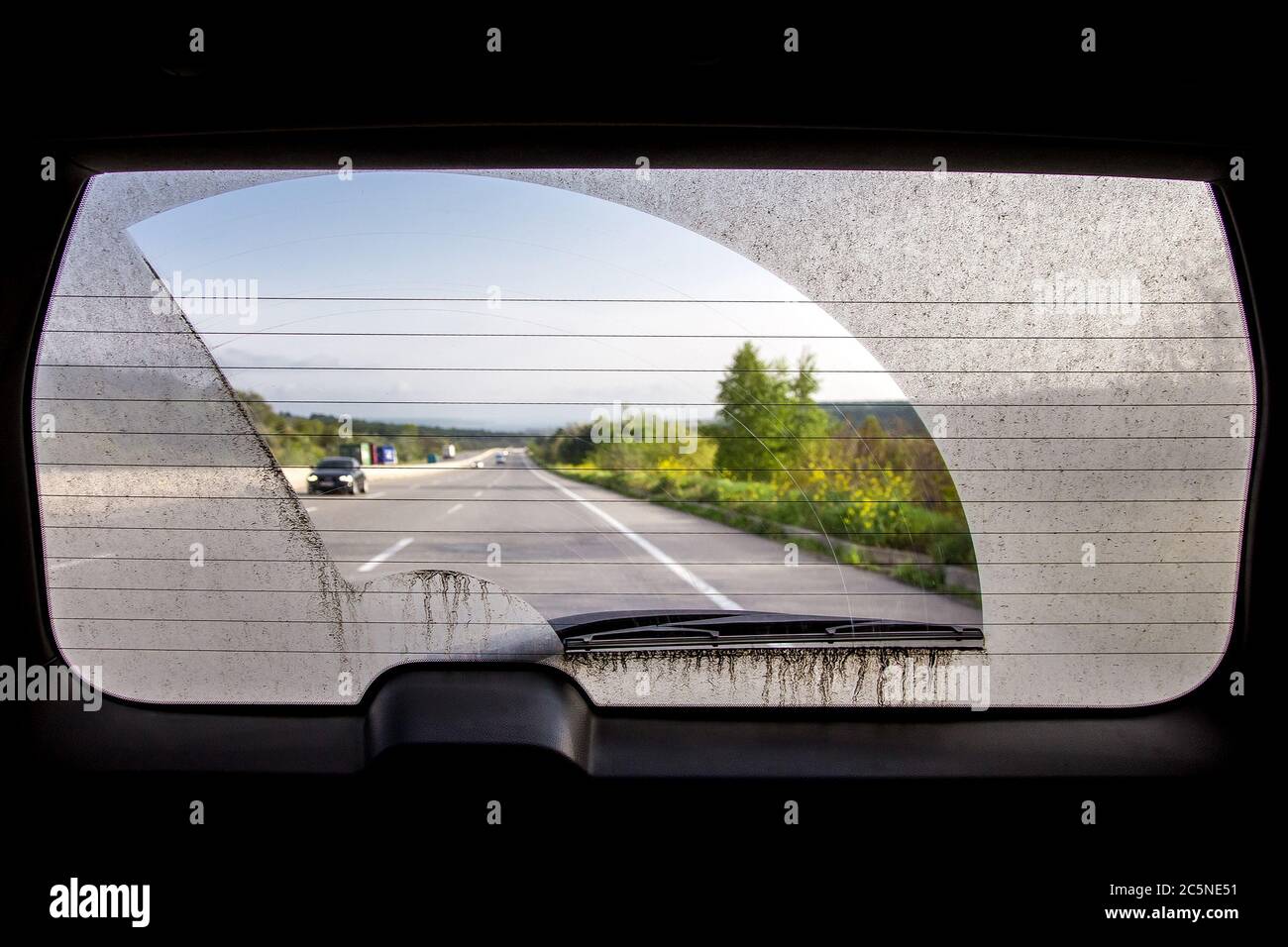 dirty car view from inside the car through the rear window, rear window ...