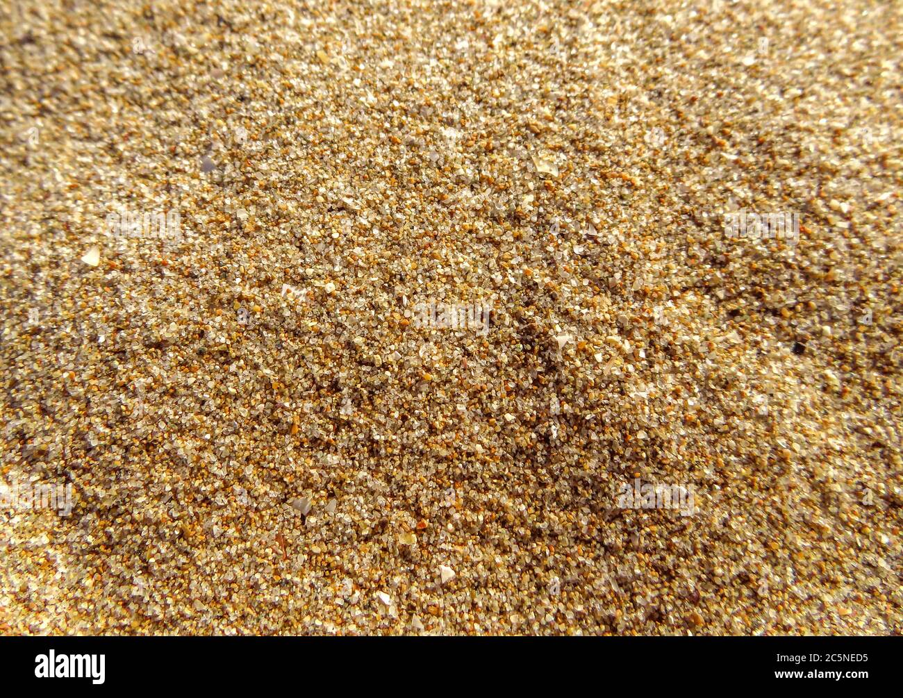 Yellow sand background on the tropical beach Stock Photo - Alamy