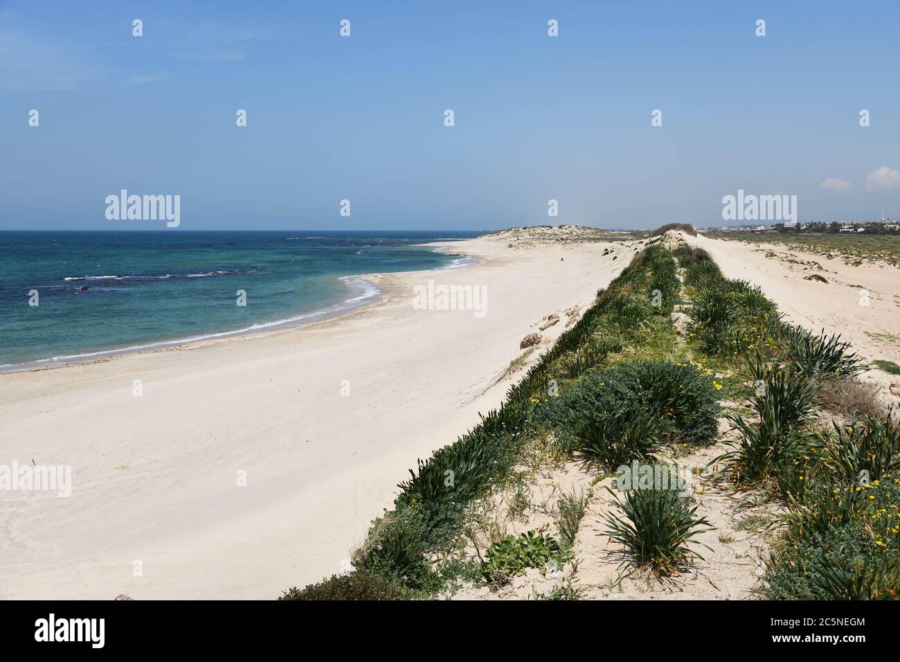 The famous beach nearby ruins of the ancient Roman Aqueduct in city of ...