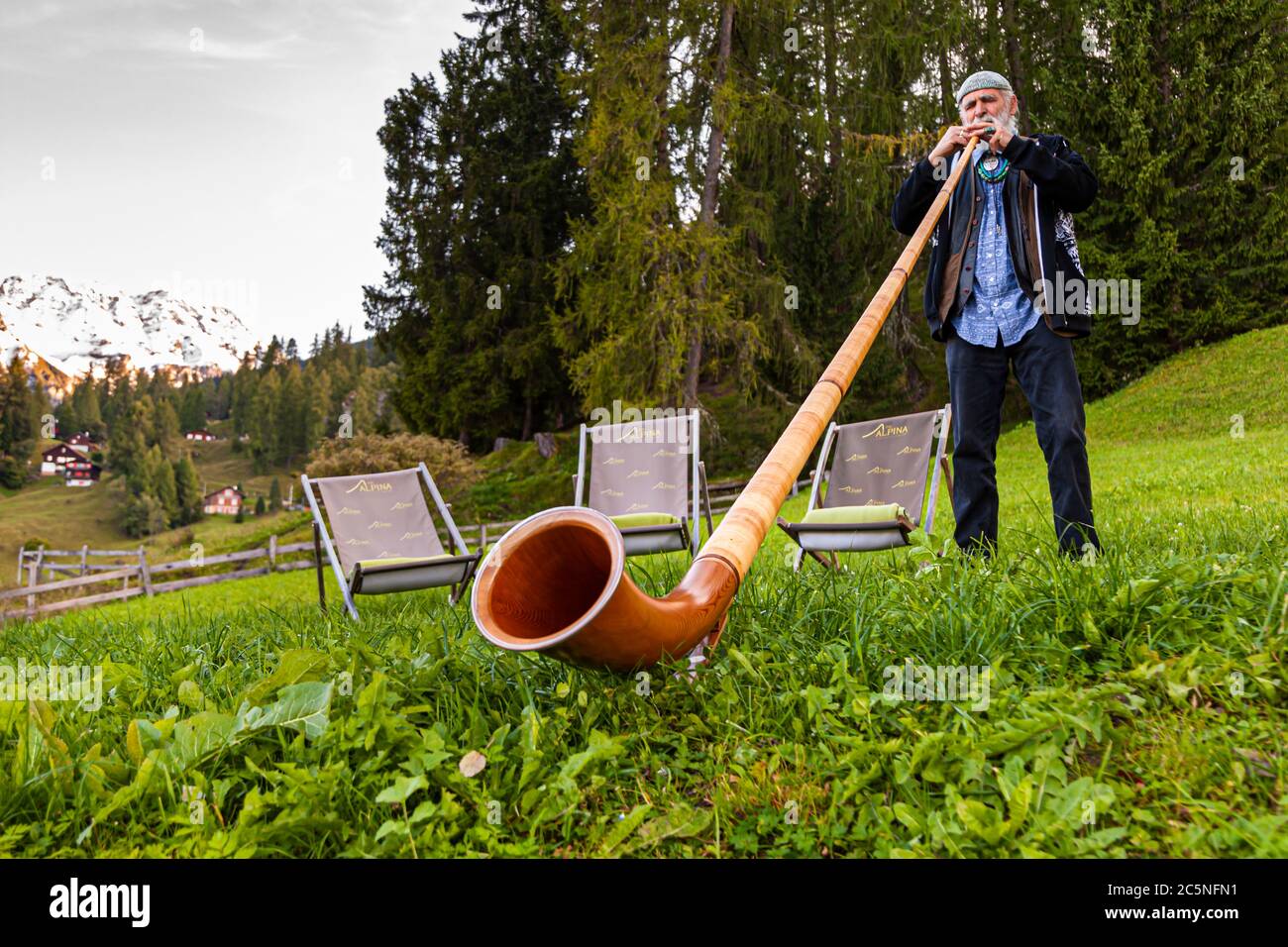 Musician playing the Alphorn in Tschiertschen-Praden, Switzerland Stock ...