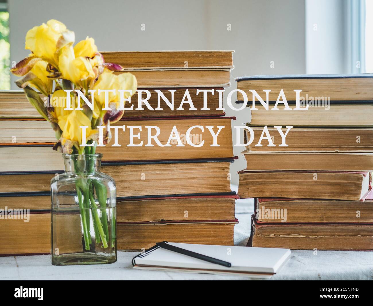 Stack of vintage books and beautiful flowers Stock Photo - Alamy