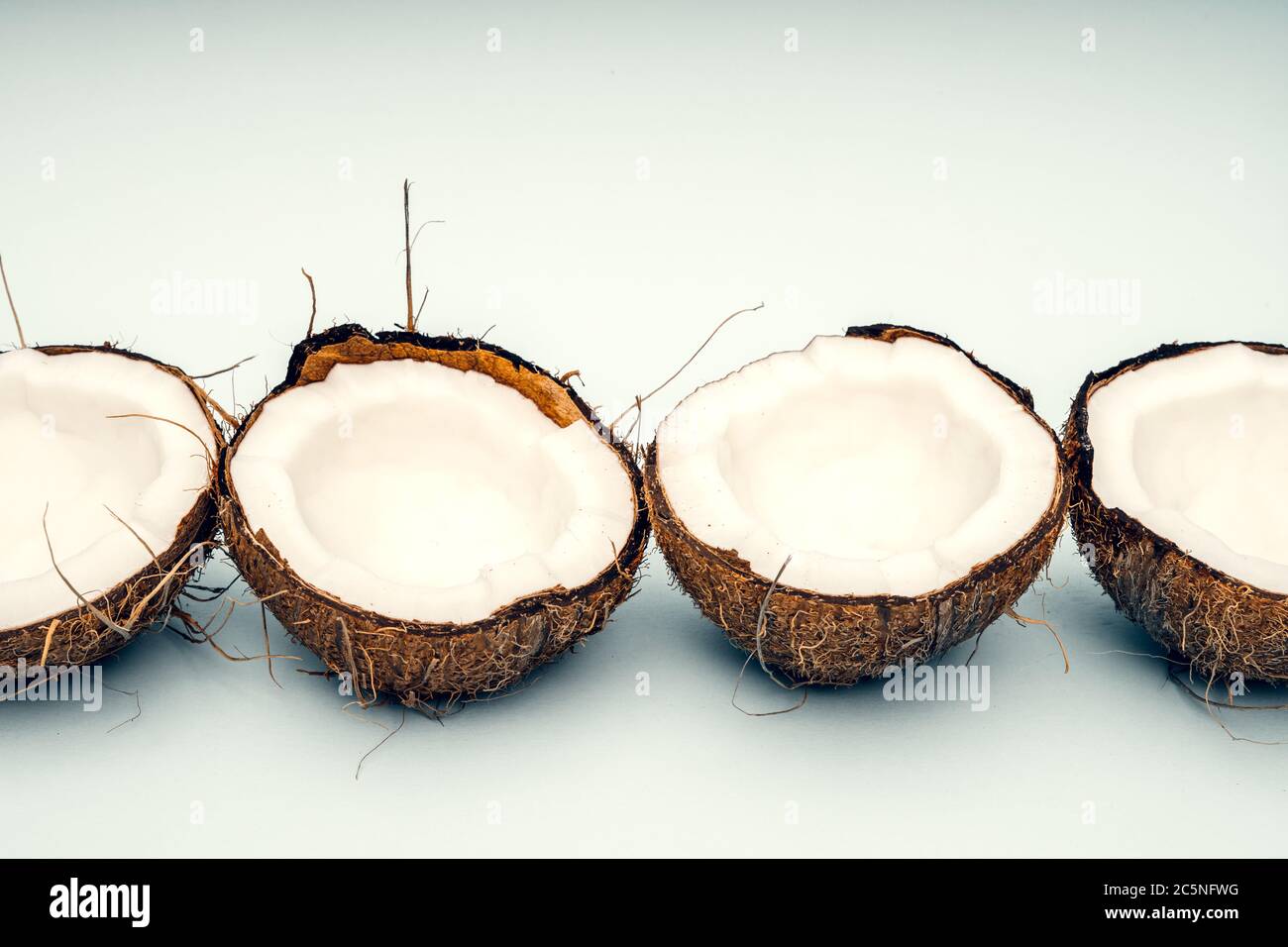 Parts of coconut on a colored background. Close up. Fresh ripe coconut ...