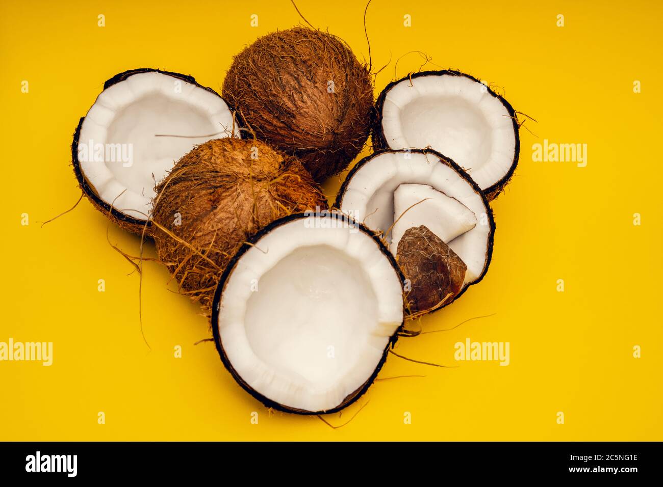 Parts of coconut on a colored background. Close up. Fresh ripe coconut ...