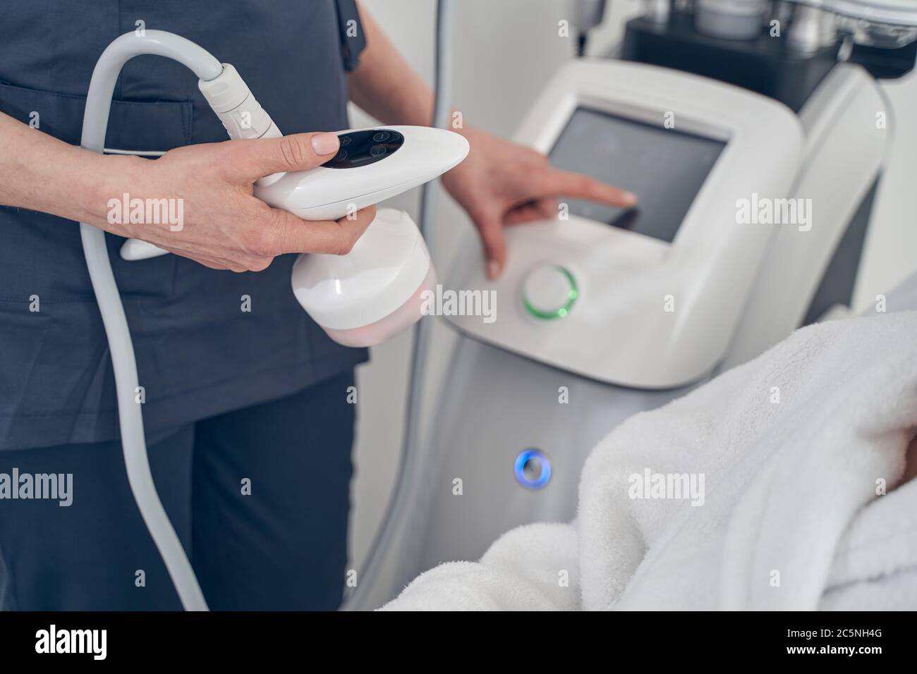 Modern hand piece of ultrasound cavitation device in clinic Stock Photo ...