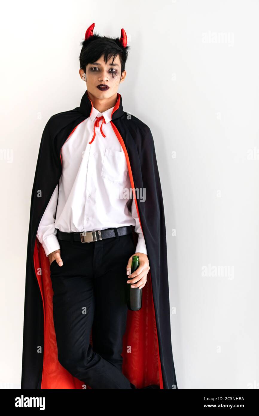 Portrait of asian young adult teenage man wear Halloween costume cloth ...