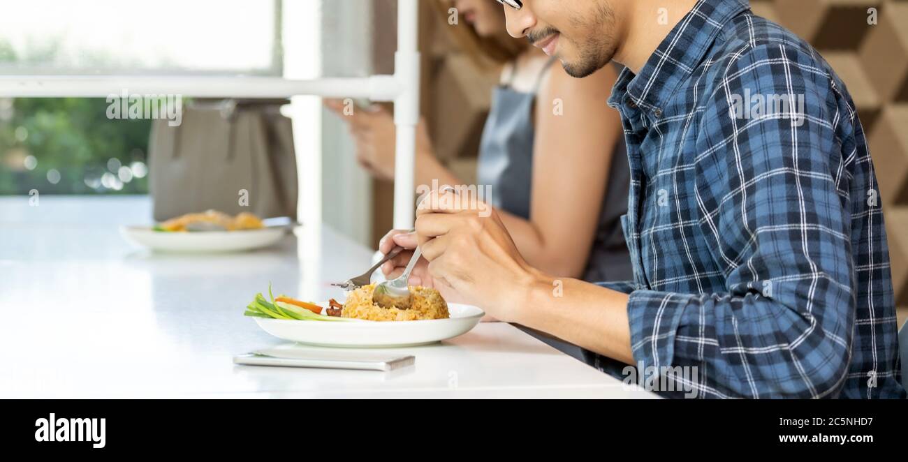 Panoramic asian customer eating out at new normal social distance ...