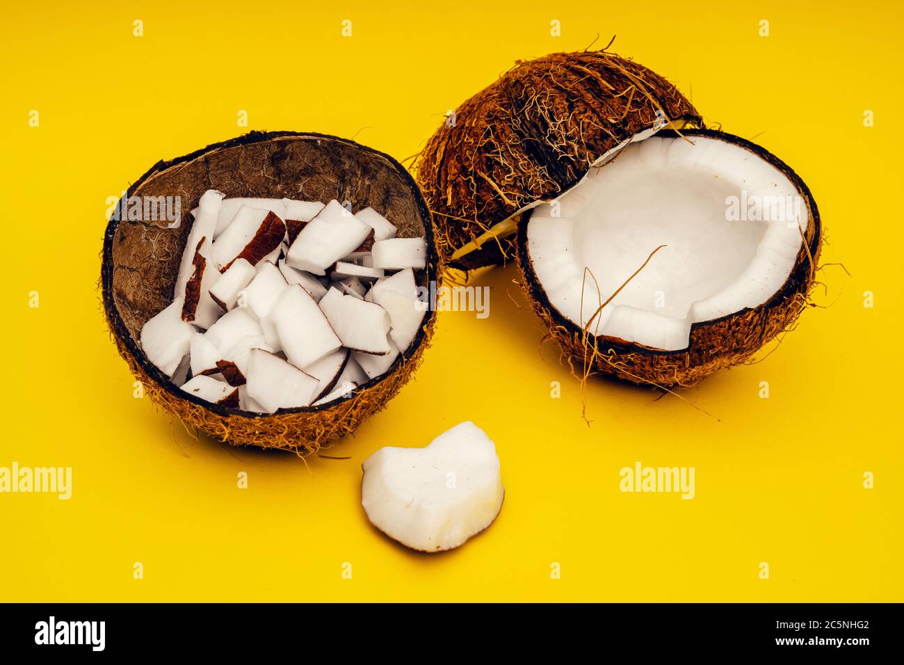 Parts of coconut on a colored background. Close up. Fresh ripe coconut ...