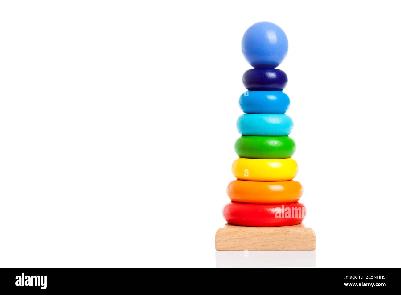 child pyramid of round shape from wooden parts of multi colors isolated ...