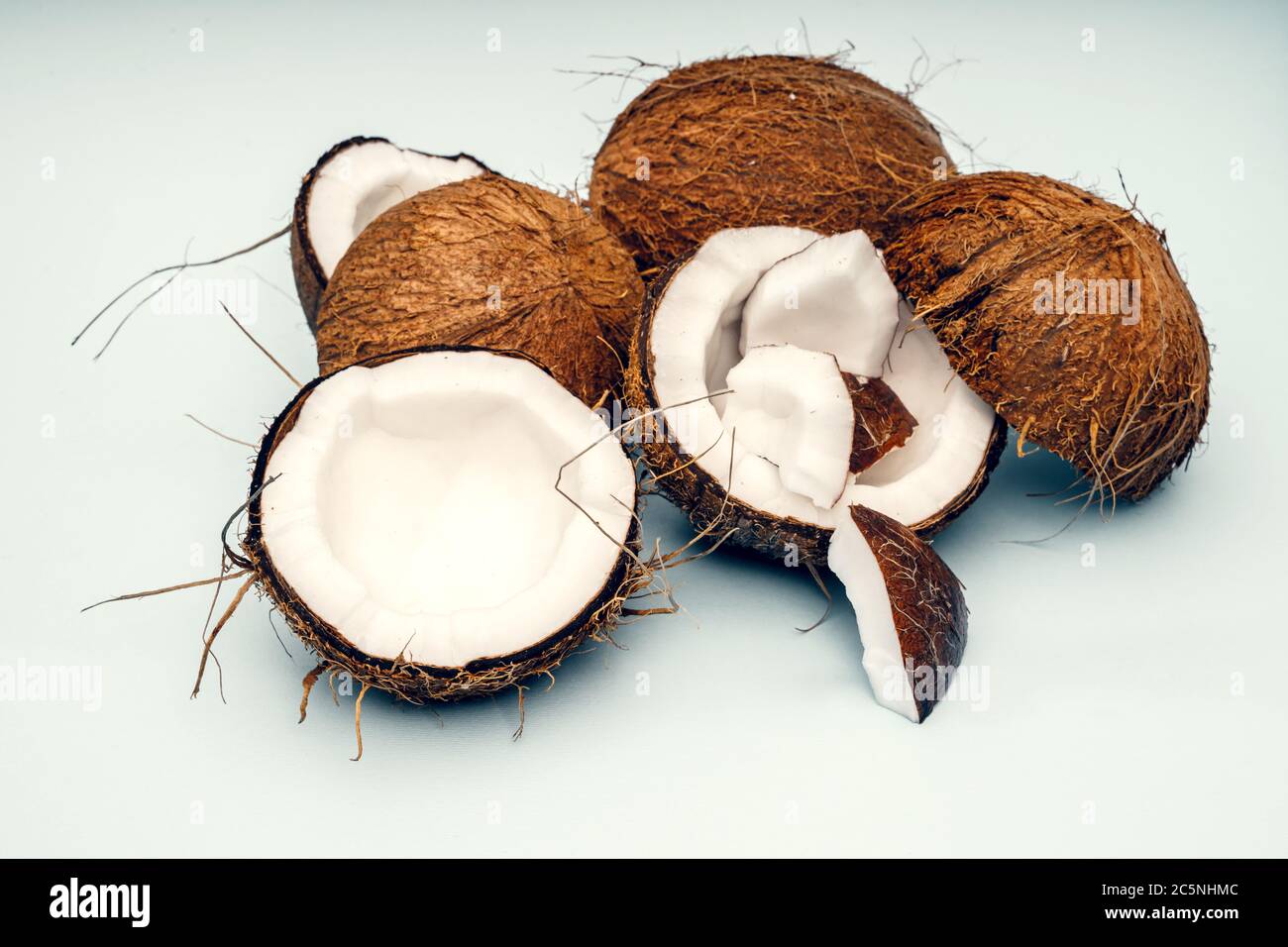 Parts of coconut on a colored background. Close up. Fresh ripe coconut ...
