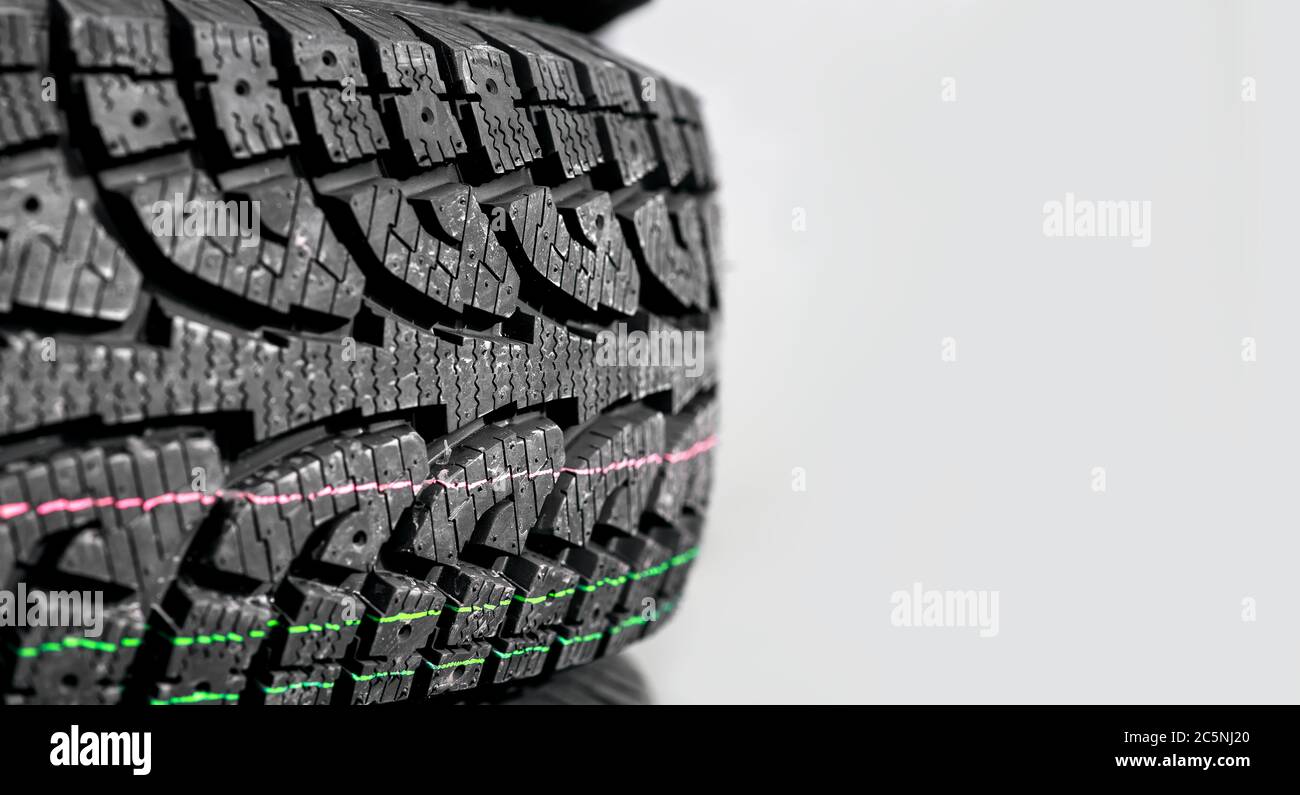 Close-up of a winter tire tread with a strip indicator with copy space ...