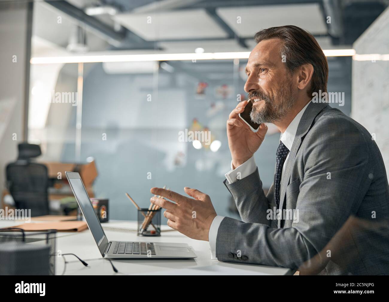 Successful man talking mobile assistant hi-res stock photography and ...
