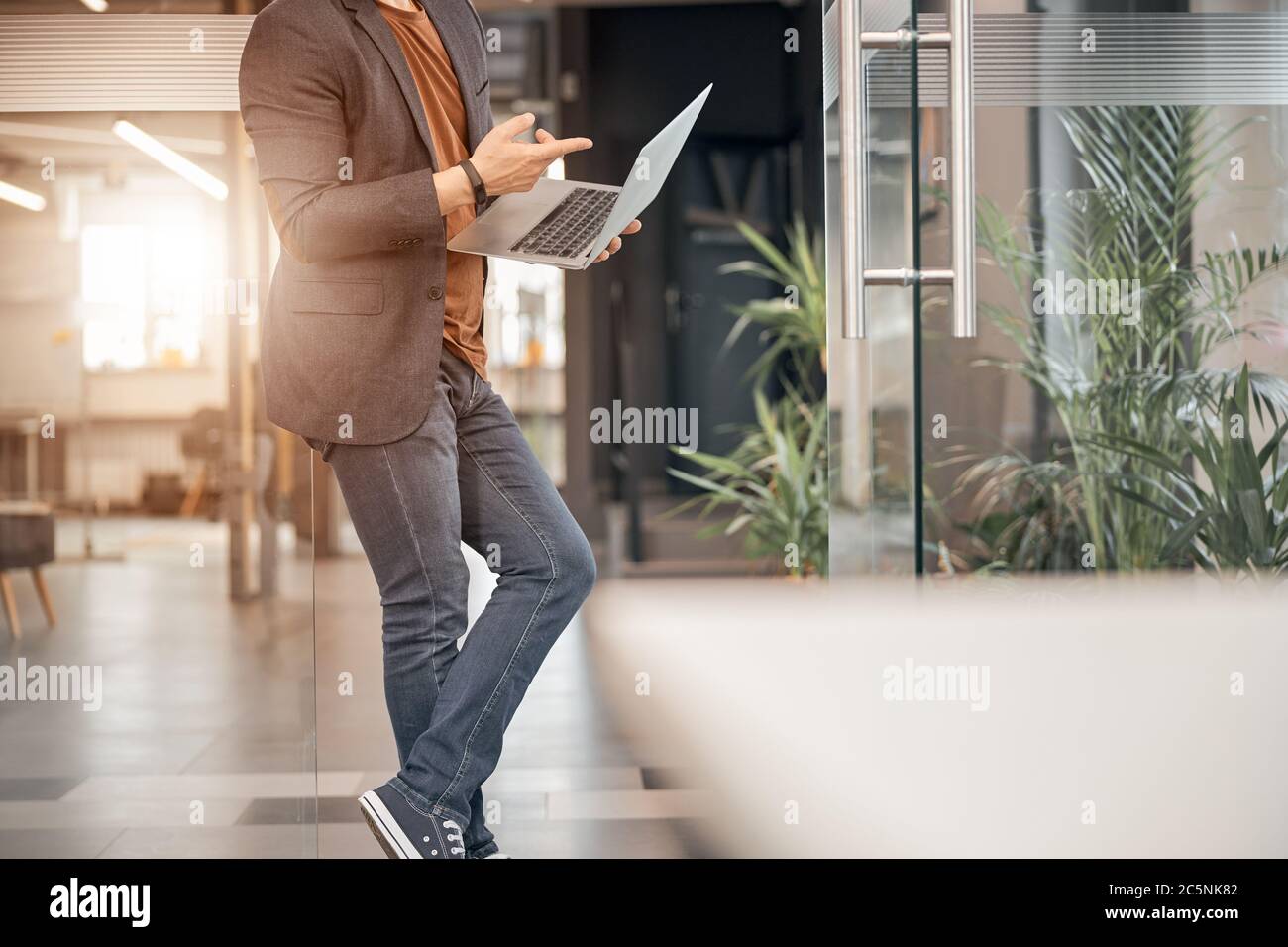 Man with notebook in hand working at the office Stock Photo - Alamy