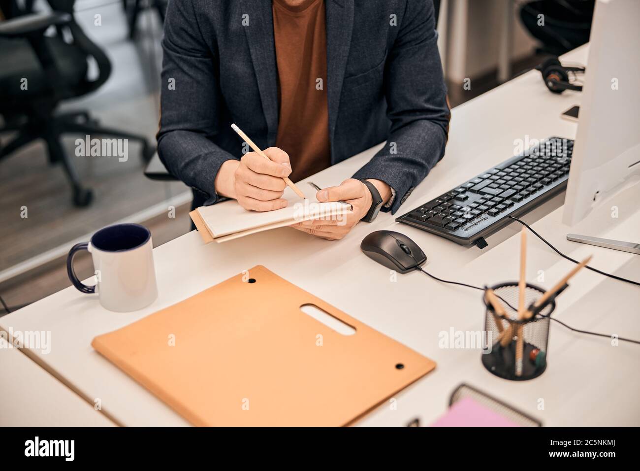 Man writing important notes on the diary Stock Photo - Alamy