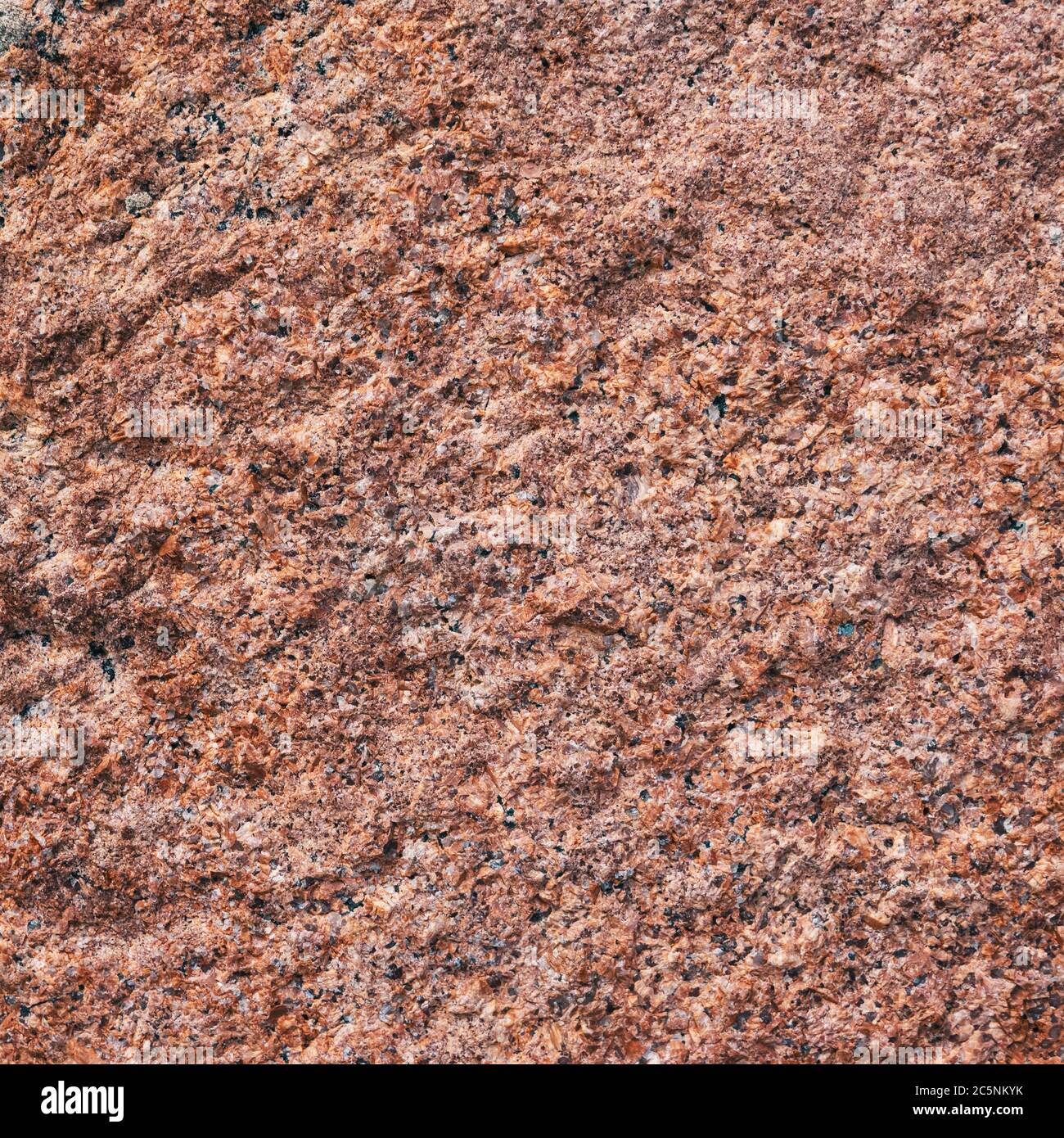 Background granite is a red stone with small black and white spots on ...