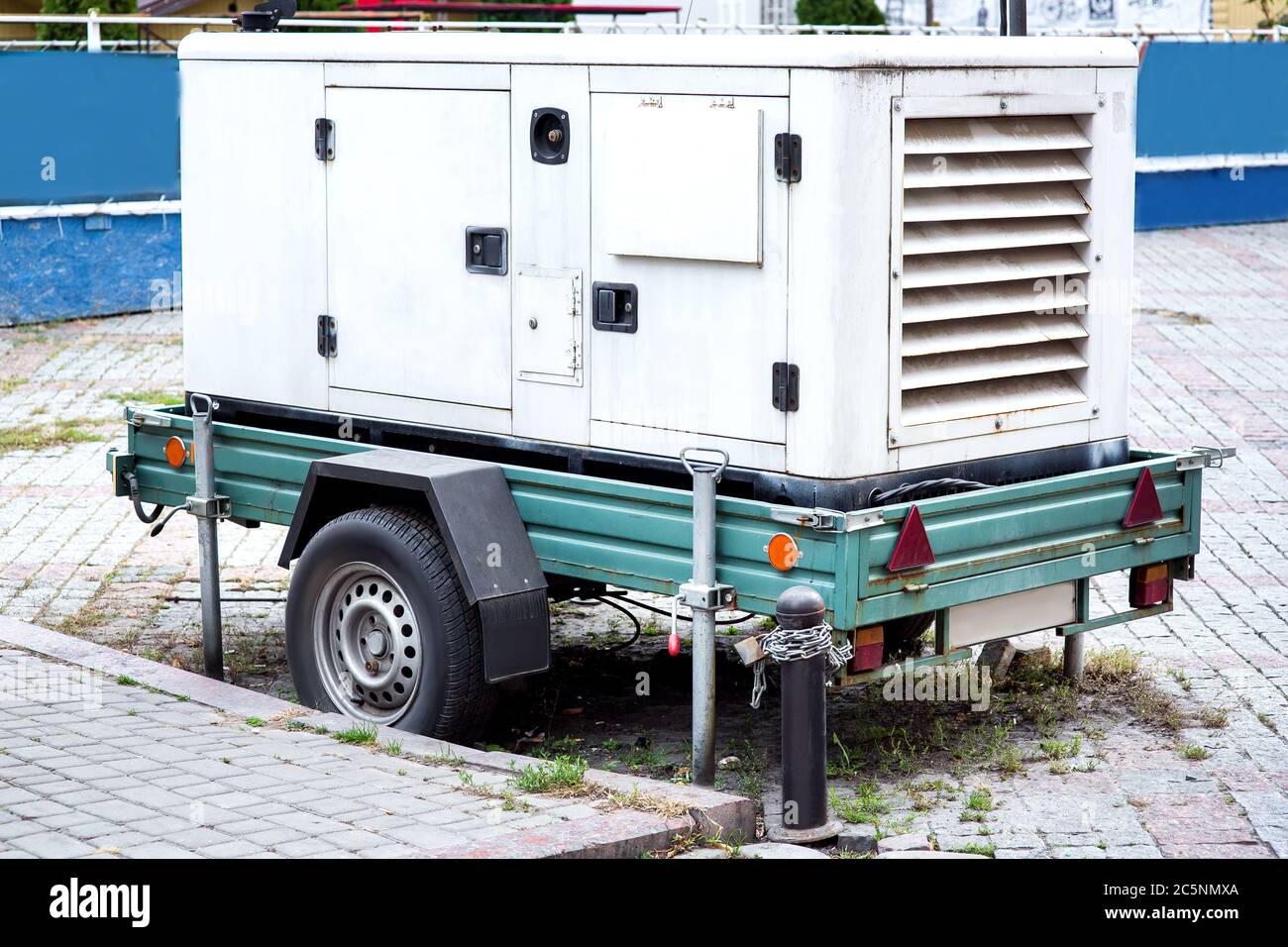backup power generator mounted on a car trailer on wheels standing on a ...
