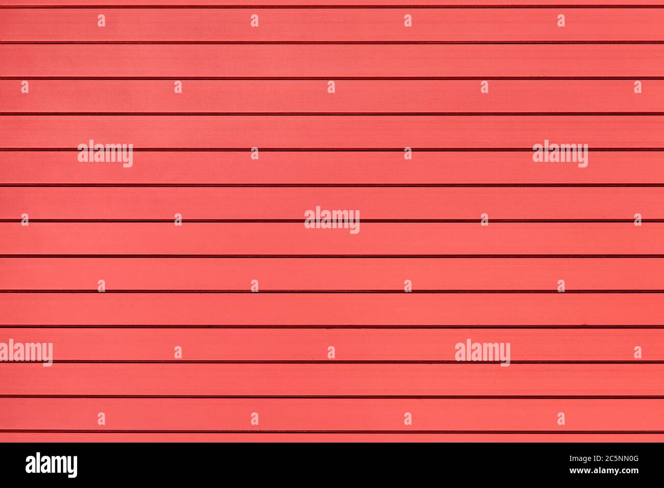 striped iron roller shutters of coral color, metal gate texture Stock ...