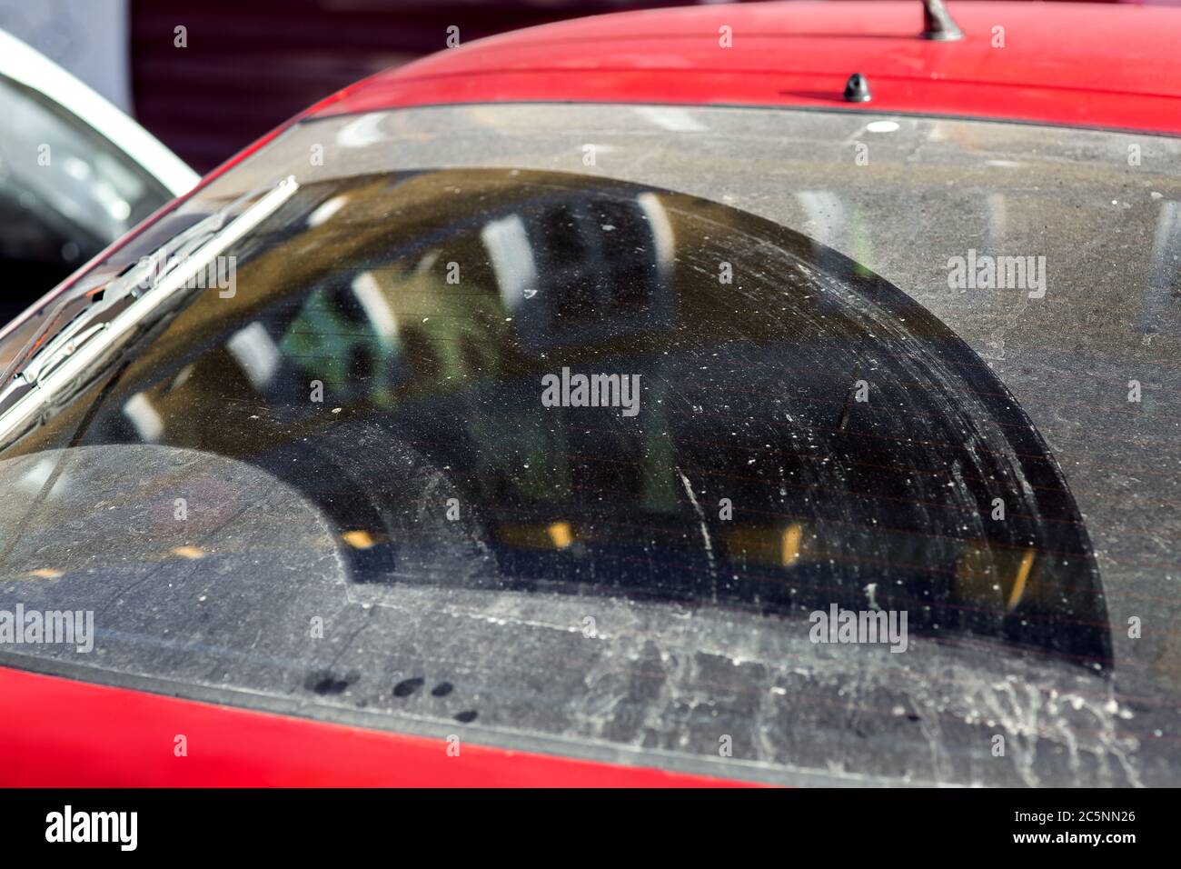 Conceptual background for car washes with dirty car glass, closeup rear ...