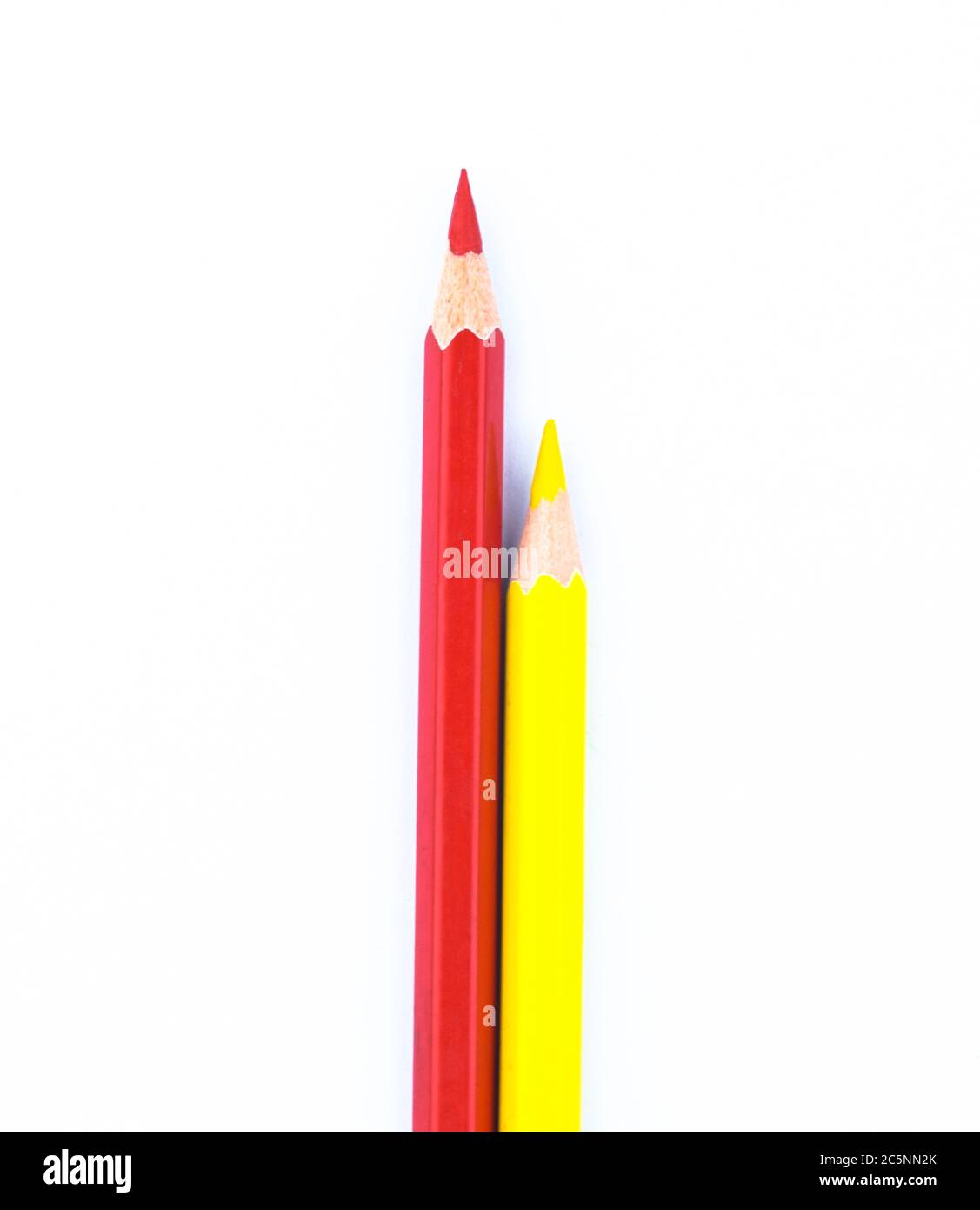 Two different colored wood pencil crayon placed beside one another on a ...