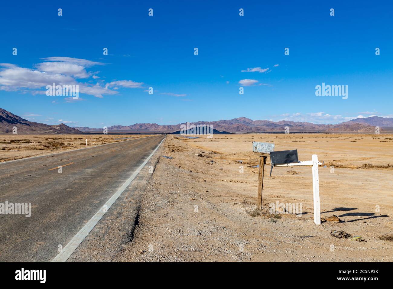 Curbside mail boxes on the side of a road, passing through rural ...