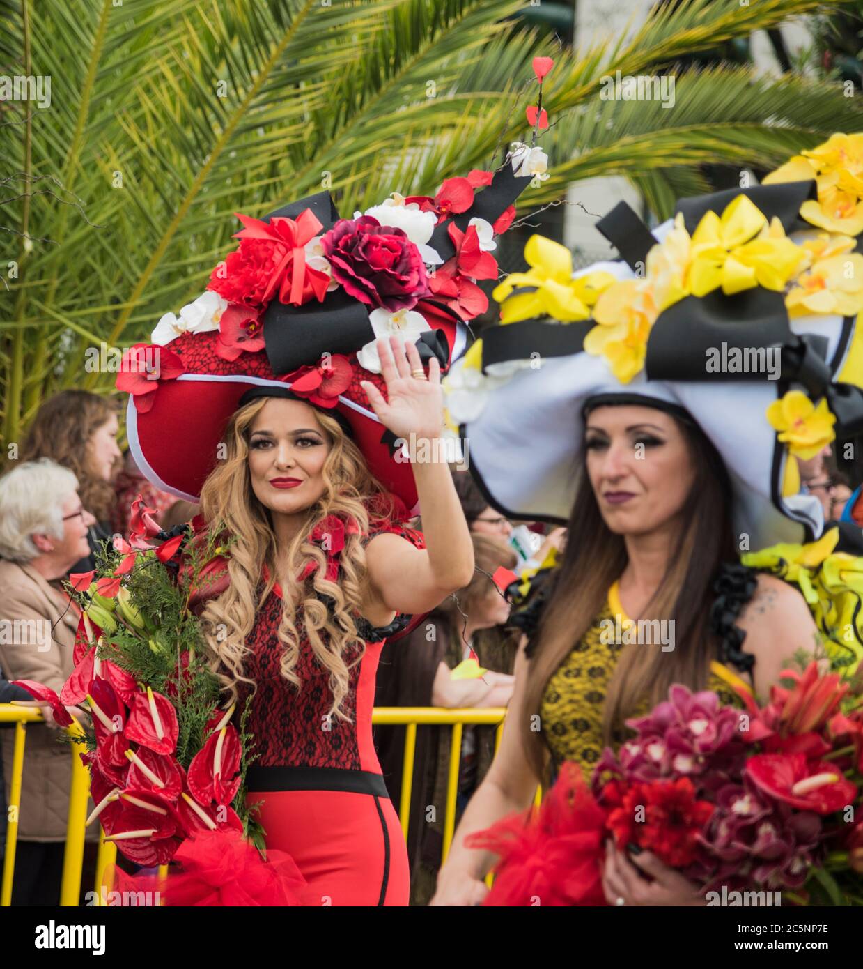 Young ladies dressed in colorful costumes during an annual flower ...