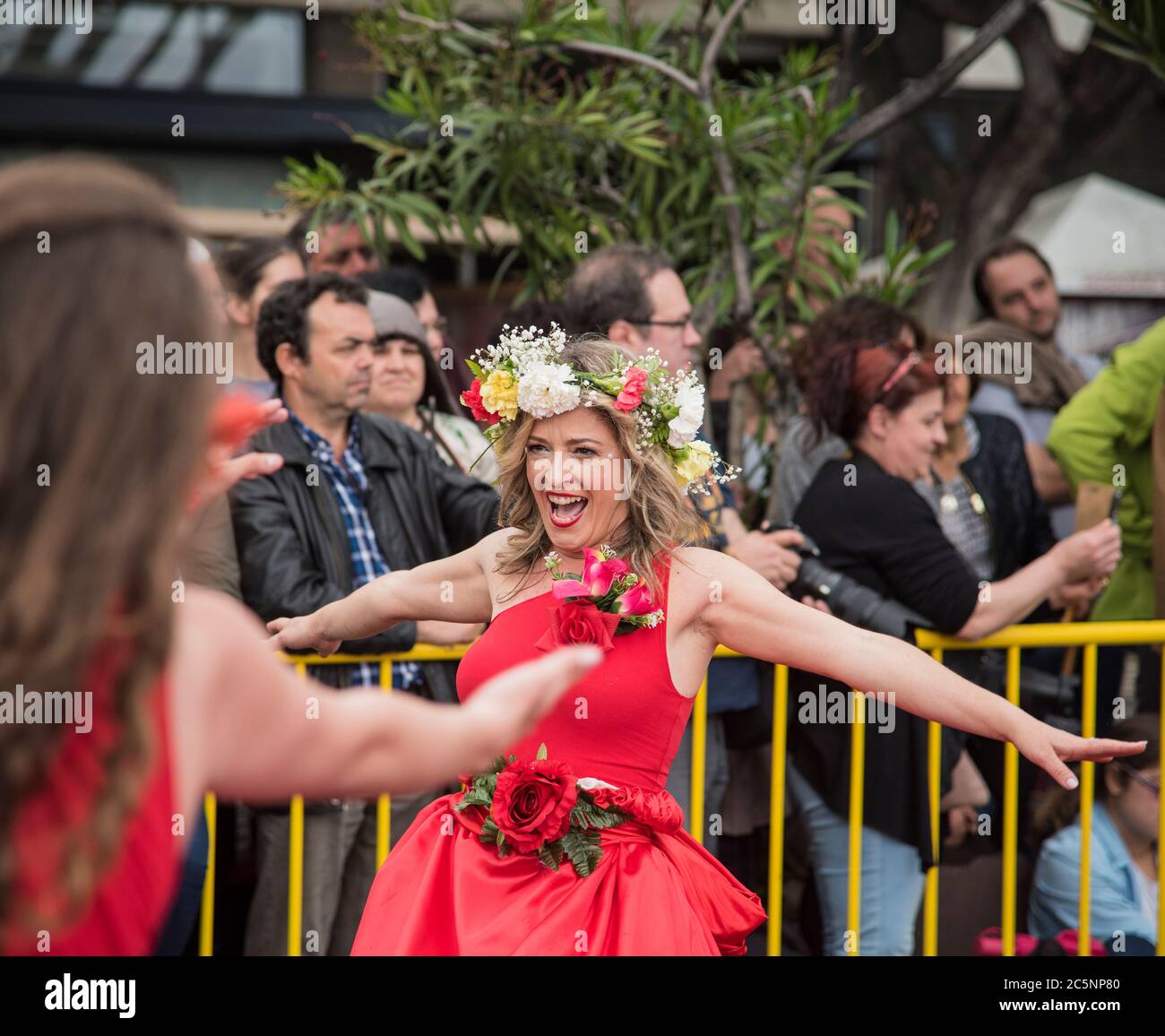 Young ladies dressed in colorful costumes during an annual flower ...